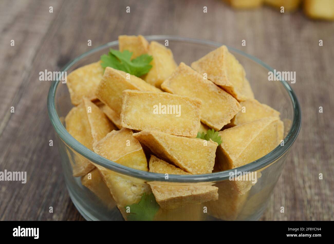 Closeup of fried tofu slices in glass bowl Stock Photo - Alamy