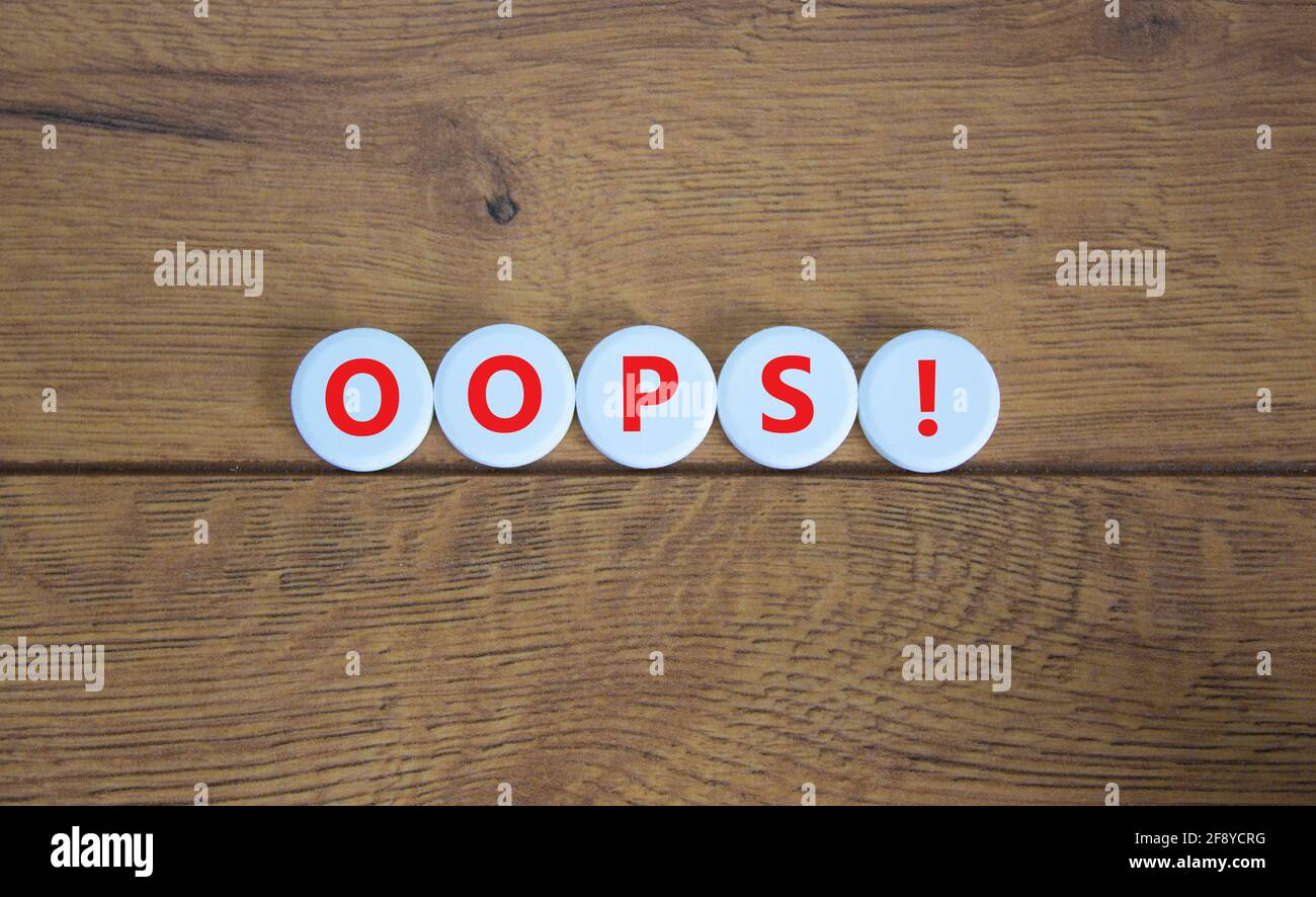 Oops symbol. Oops sign on white circles. Beautiful wooden background ...
