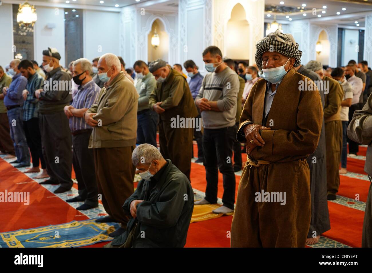 Iraqi Kurdish people maintain social distance as they offer Tarawih ...