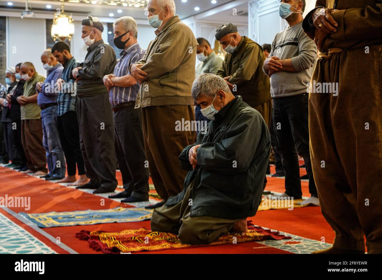 Duhok, Iraq. 13th Apr, 2021. Iraqi Kurdish people maintain social ...