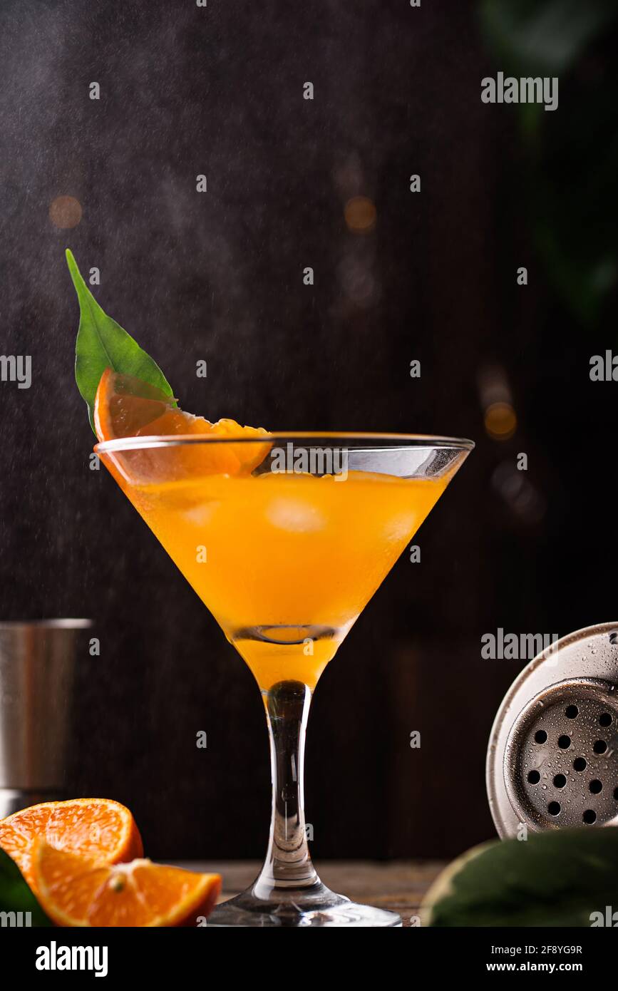 Orange martini cocktail in rustic style Stock Photo - Alamy