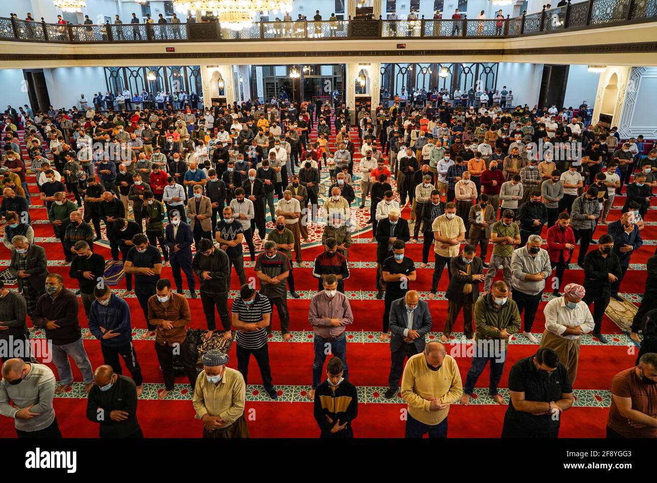 Iraqi Kurdish people maintain social distance as they offer Tarawih ...