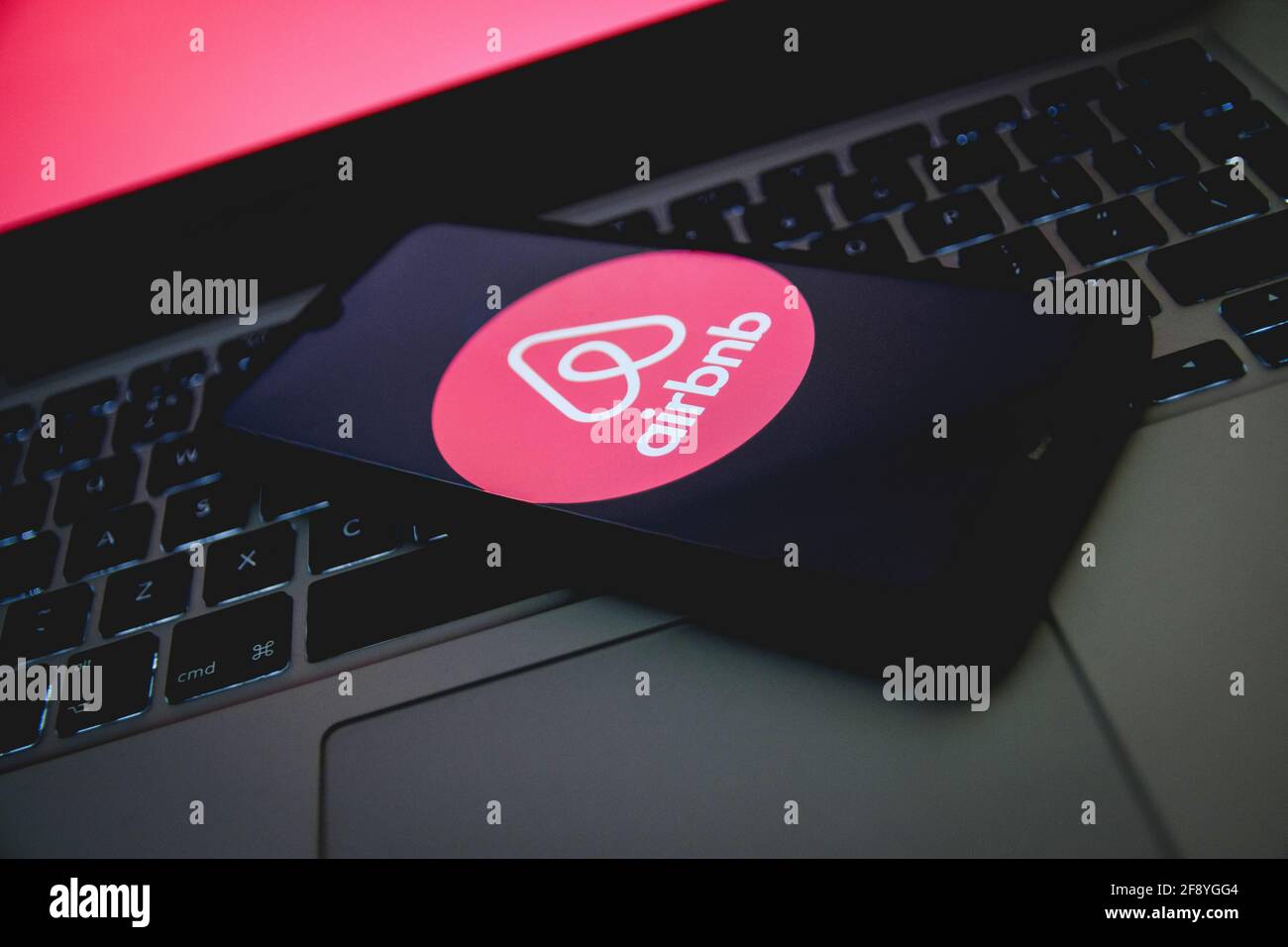 In this photo illustration Airbnb logo is seen displayed on a ...