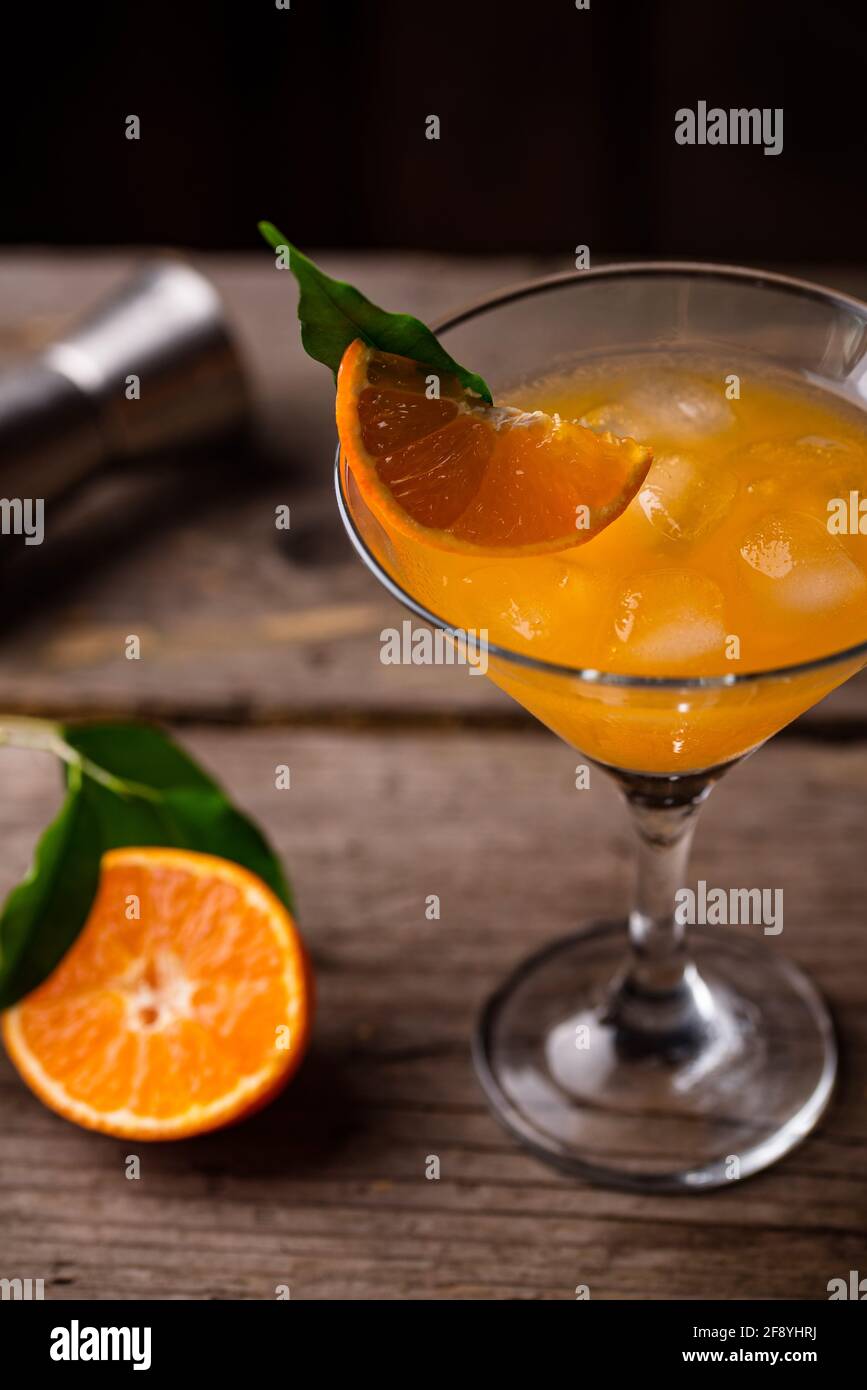 Orange martini cocktail in rustic style Stock Photo - Alamy