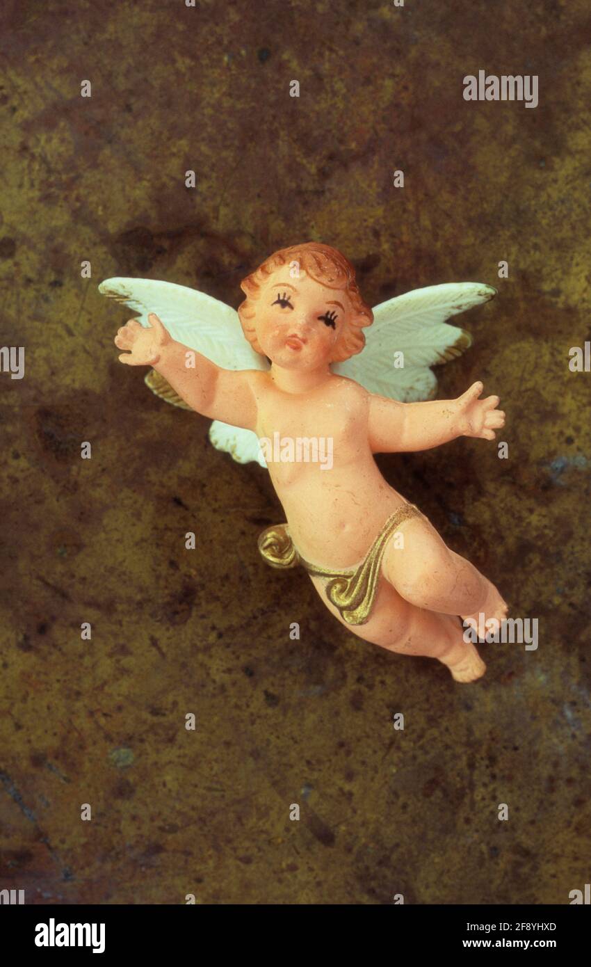 Model of cherub flying with outstretched arms Stock Photo - Alamy