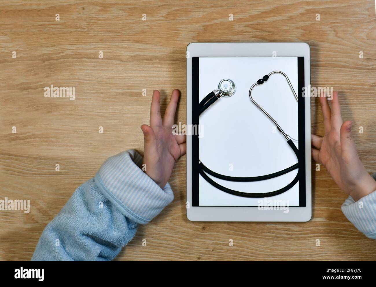 Smile on the tablet screen drawn by a stethoscope. And open with ...