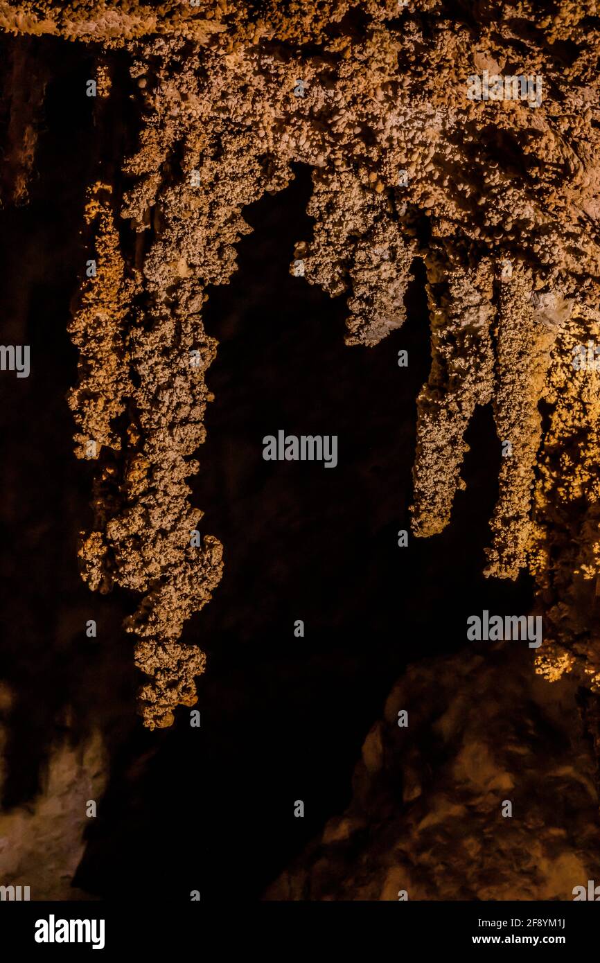 Cave Popcorn on stalactites deep underground in Carlsbad Caverns ...