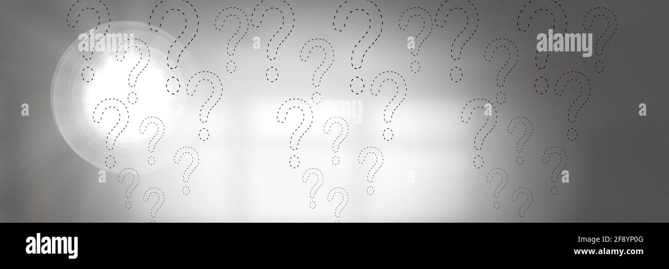 Multiple question marks against a white office building background ...