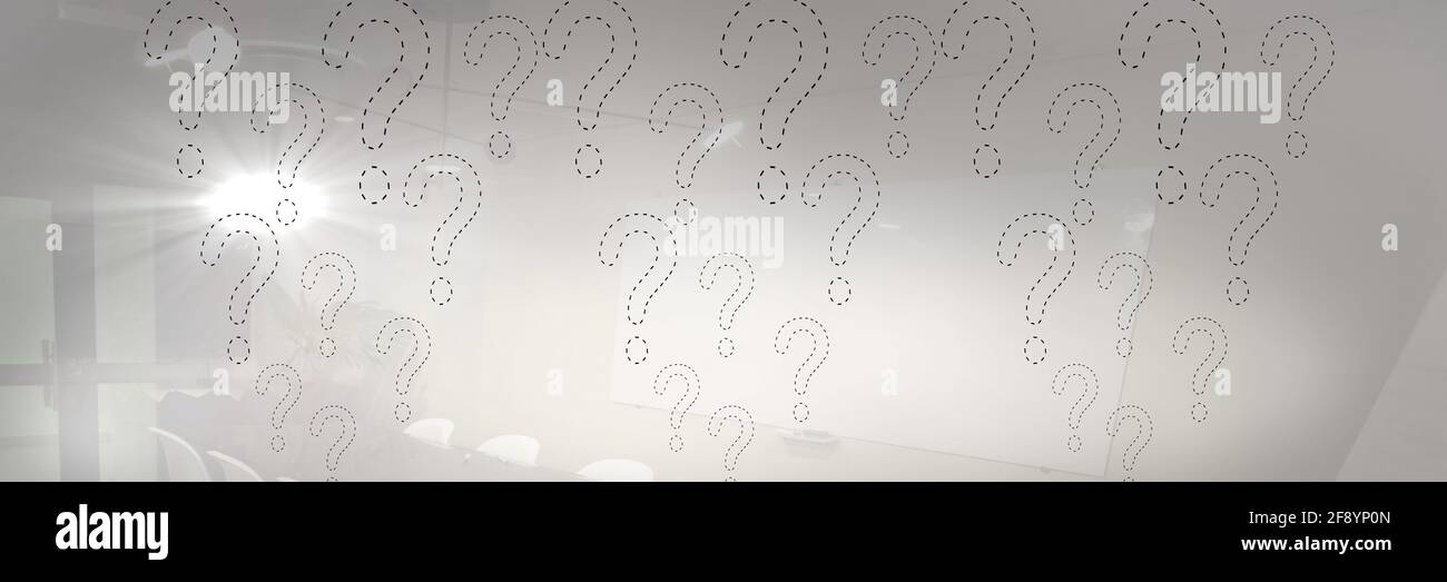Multiple question marks against a white office building background ...