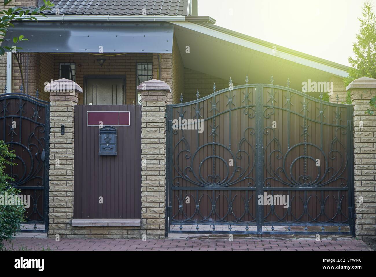 Forged metal gates with ornate lines in a private house Stock Photo - Alamy