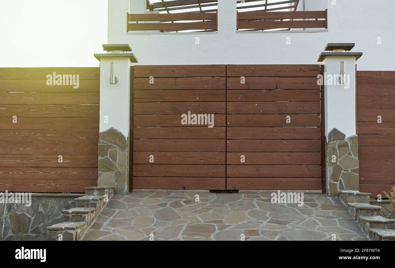 Brown wooden gate and fence Stock Photo - Alamy