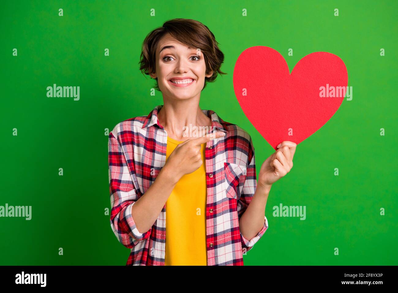 Photo of cheerful person indicate finger empty space cardiology heart ...