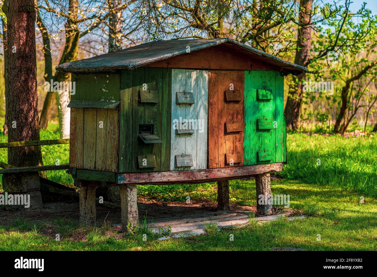 Old colorful apiary in the orchard, Poland Stock Photo - Alamy