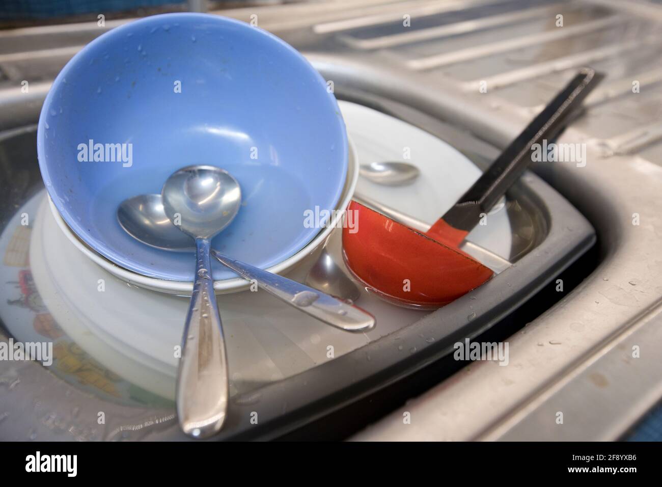 Washing up piled in hi-res stock photography and images - Alamy