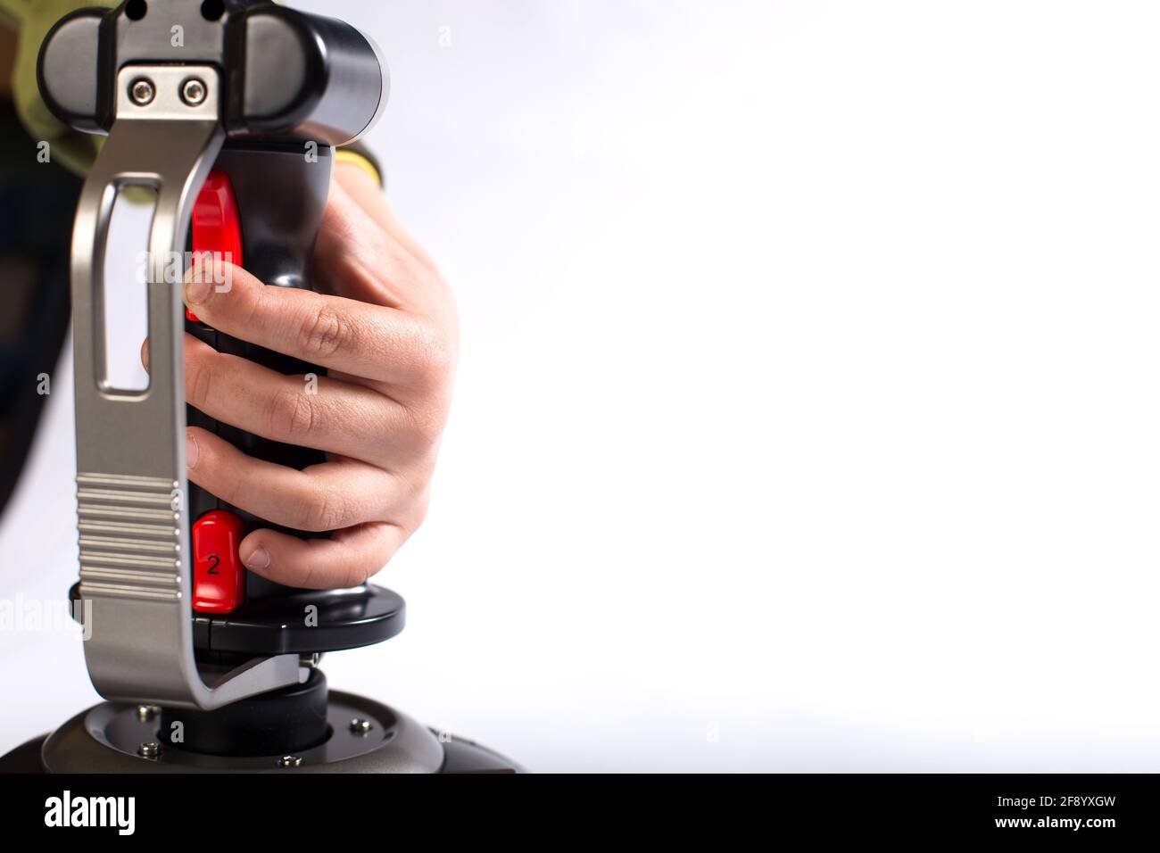 Child hand playing with joystick for aircraft control on a white ...