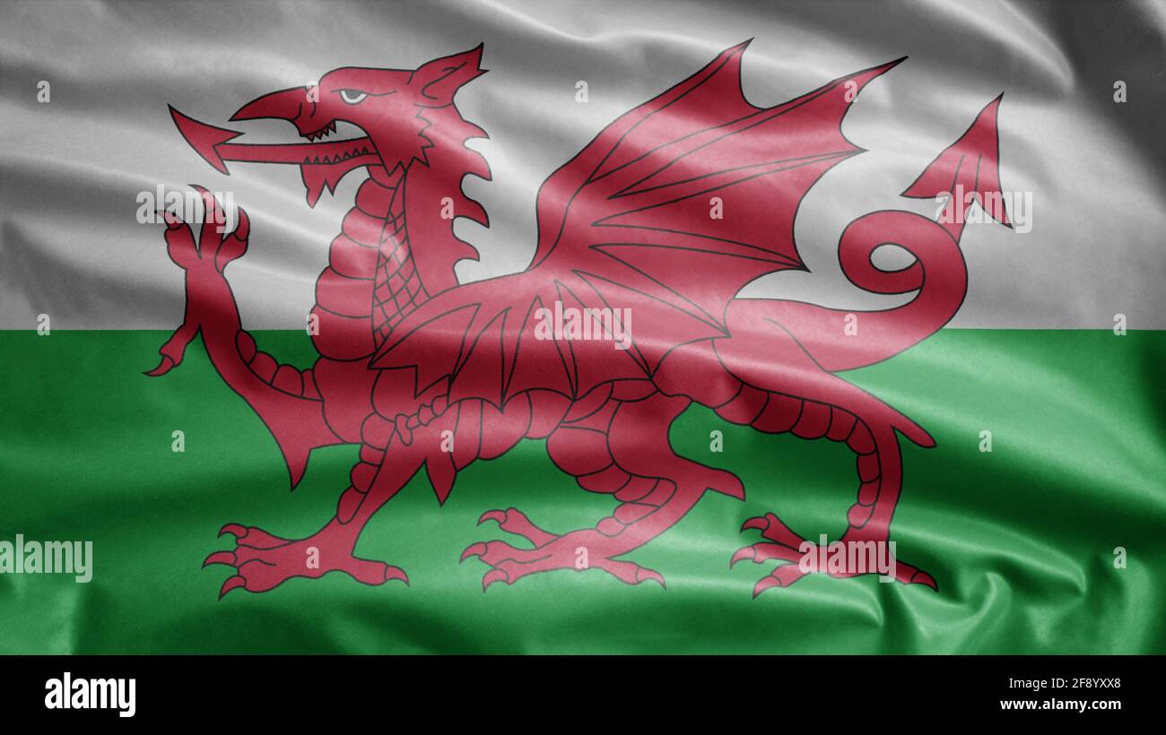 Welsh flag waving in the wind. Close up of Wales banner blowing, soft ...
