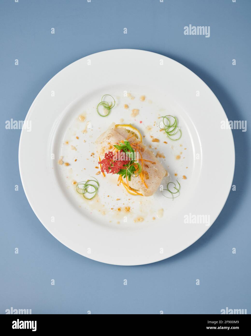 Vertical top view of a minimalistic salad on a white plate Stock Photo ...
