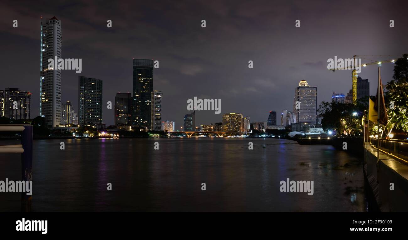 Night view up the River Phraya in Bangkok showing buildings lit up Stock Photo - Alamy