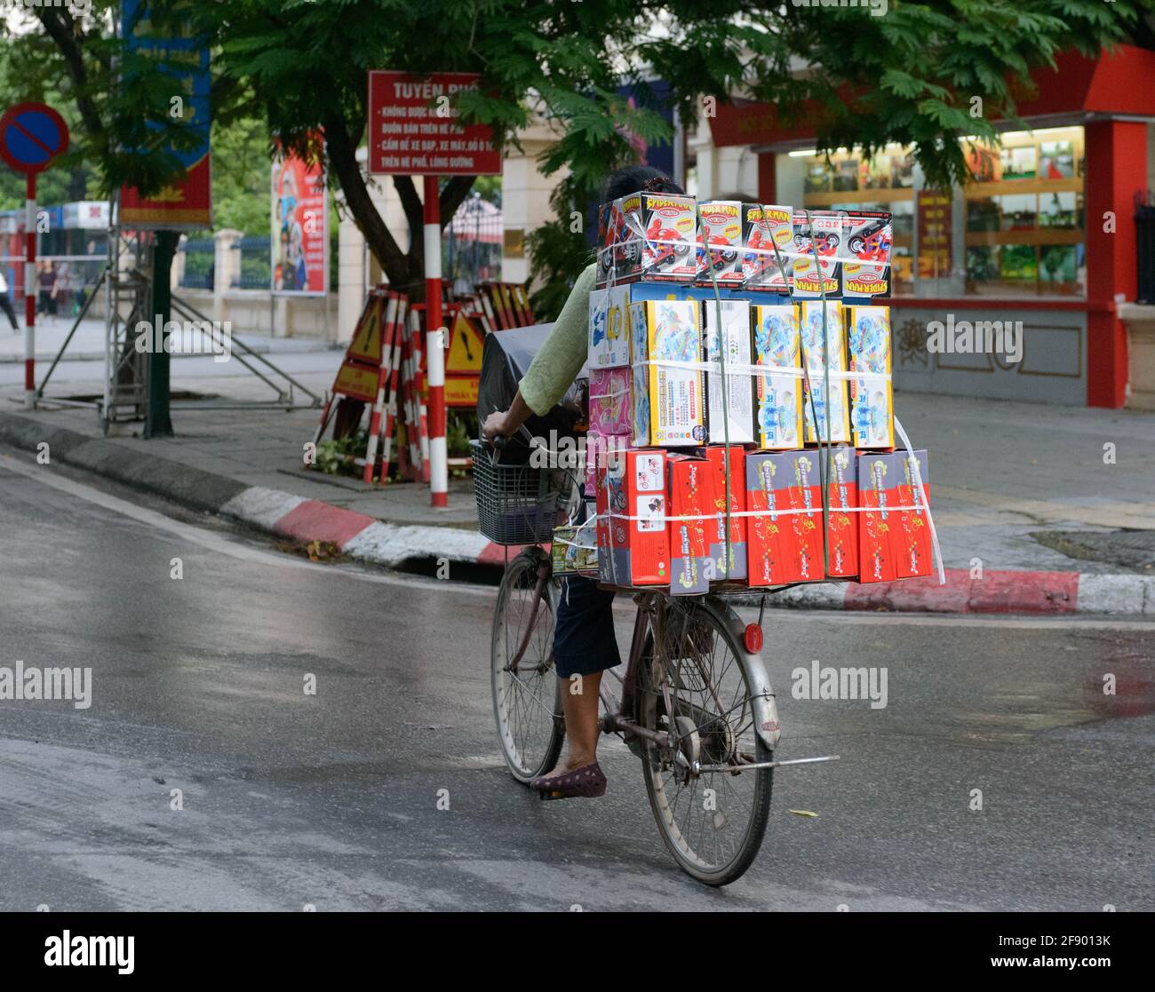Bicycle carrying large load of boxes in Hanoi, Vietnam Stock Photo - Alamy