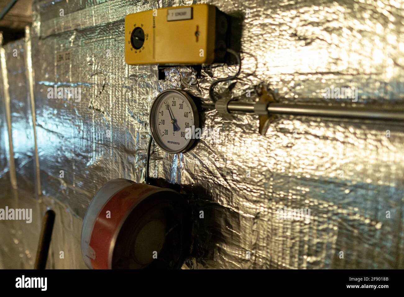 Selective focus of a pressure gauge attached to a foil covered surface ...