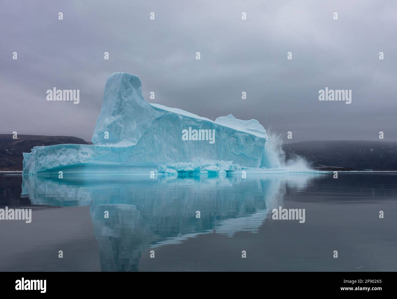 Iceberg calving Qikiqtarjuaq, Nunavut, Canada Stock Photo - Alamy