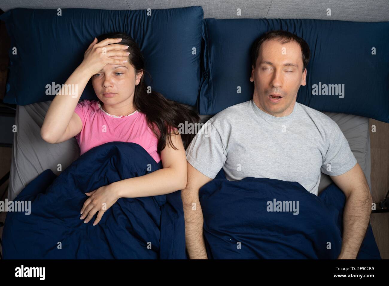 Woman angry man asleep hi-res stock photography and images - Alamy