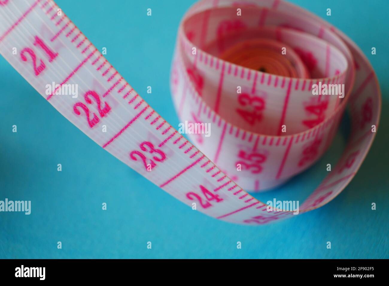 close up of a tape measure with pink numbers and markings Stock Photo ...