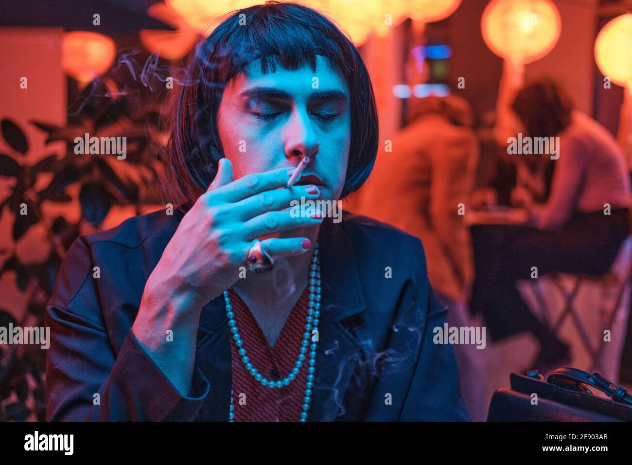 Lighting cigarette club hi-res stock photography and images - Alamy