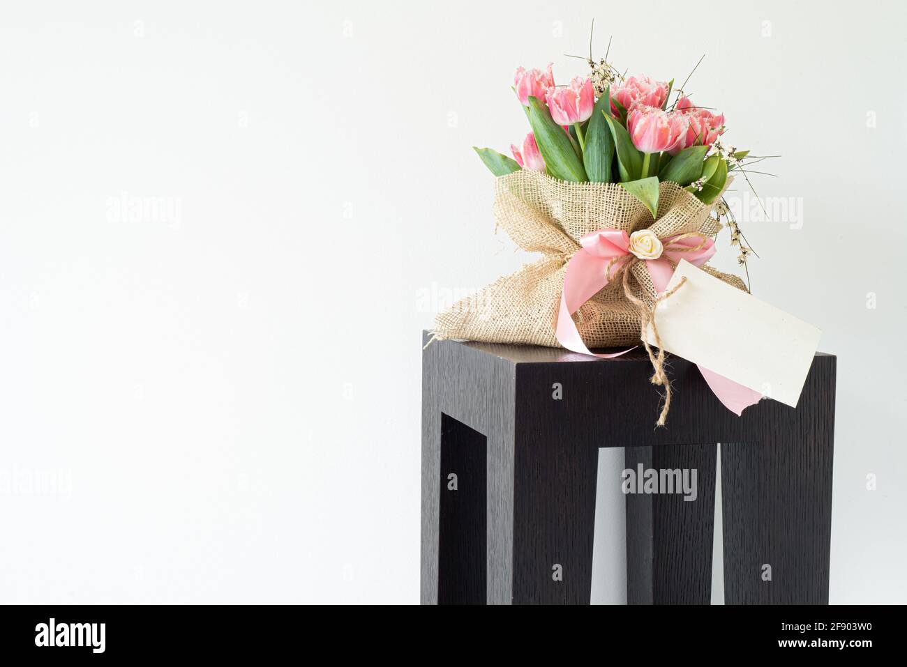 Blank paper greeting card, invitation. Bouquet of fresh pink tulips ...