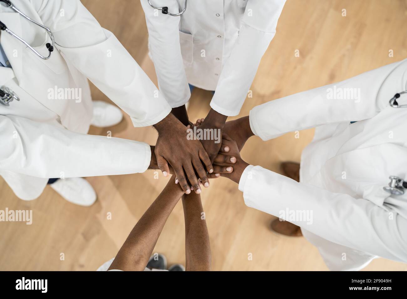 African American Medical Team Staff Hands Stack Stock Photo - Alamy
