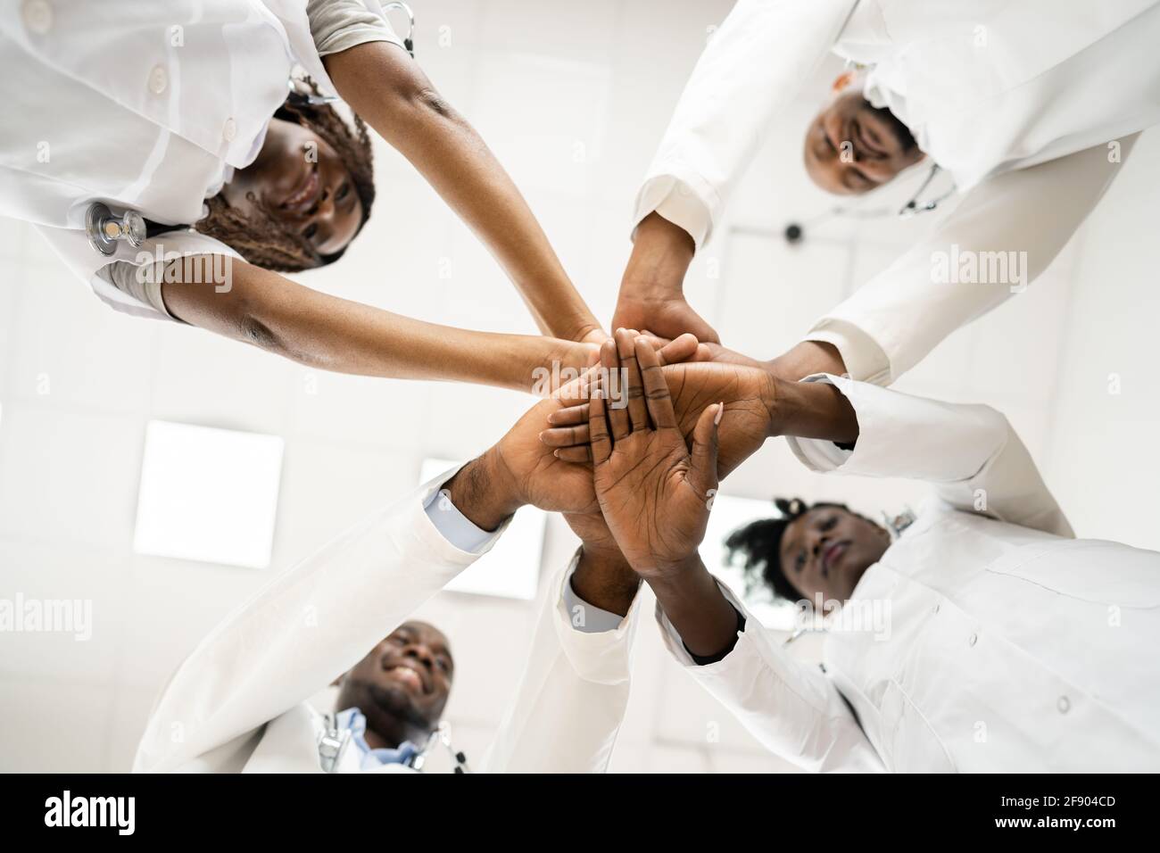 African American Medical Team Staff Hands Stack Stock Photo - Alamy