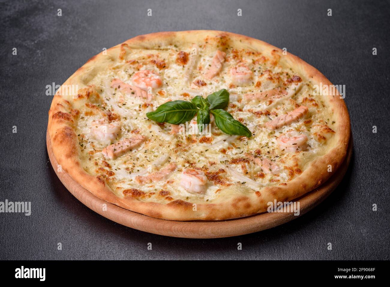 Delicious fresh seafood oven pizza: red fish and shrimp. Healthy food ...