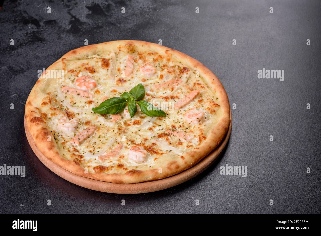 Delicious fresh seafood oven pizza: red fish and shrimp. Healthy food ...