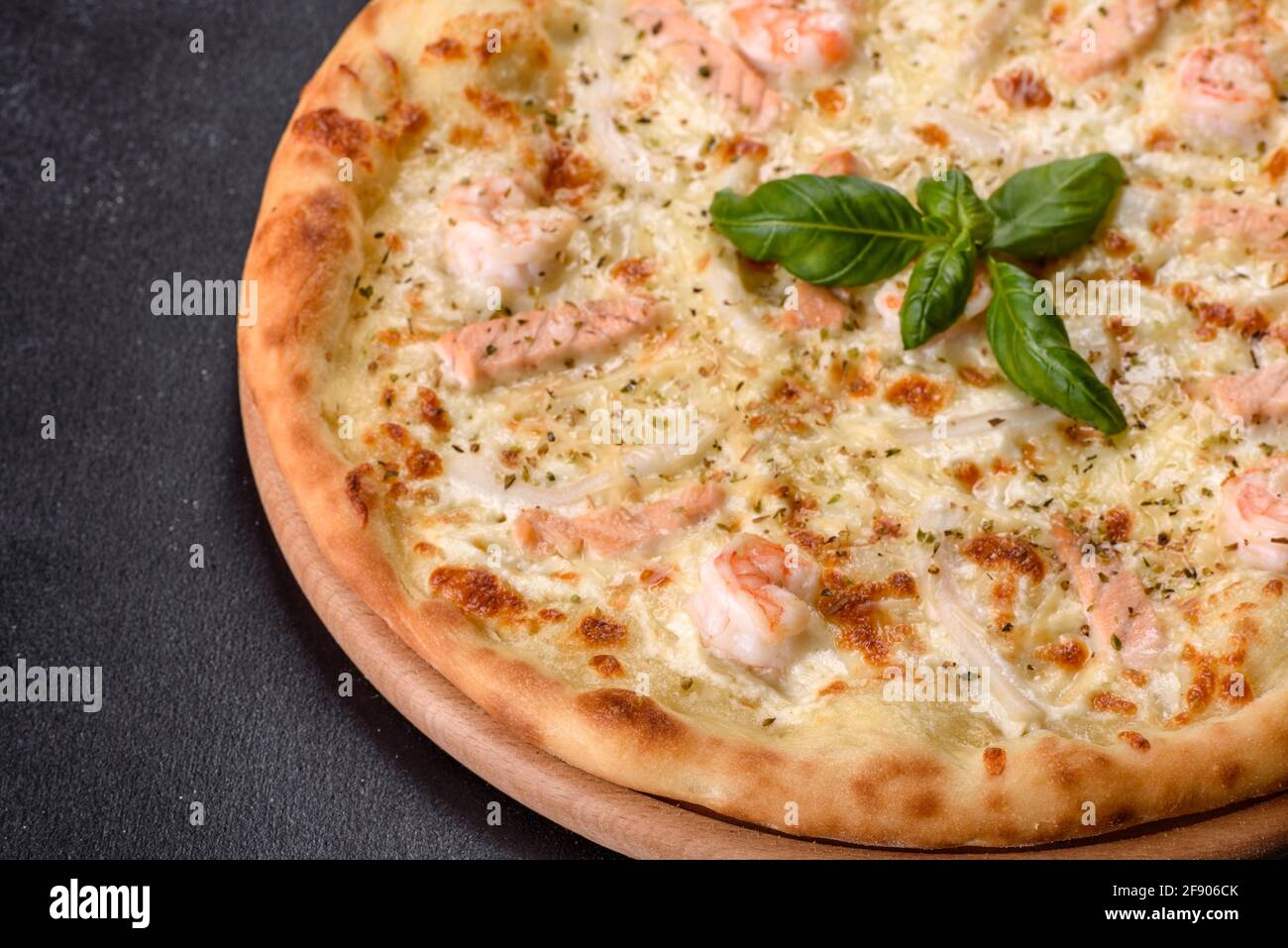 Delicious fresh seafood oven pizza: red fish and shrimp. Healthy food ...