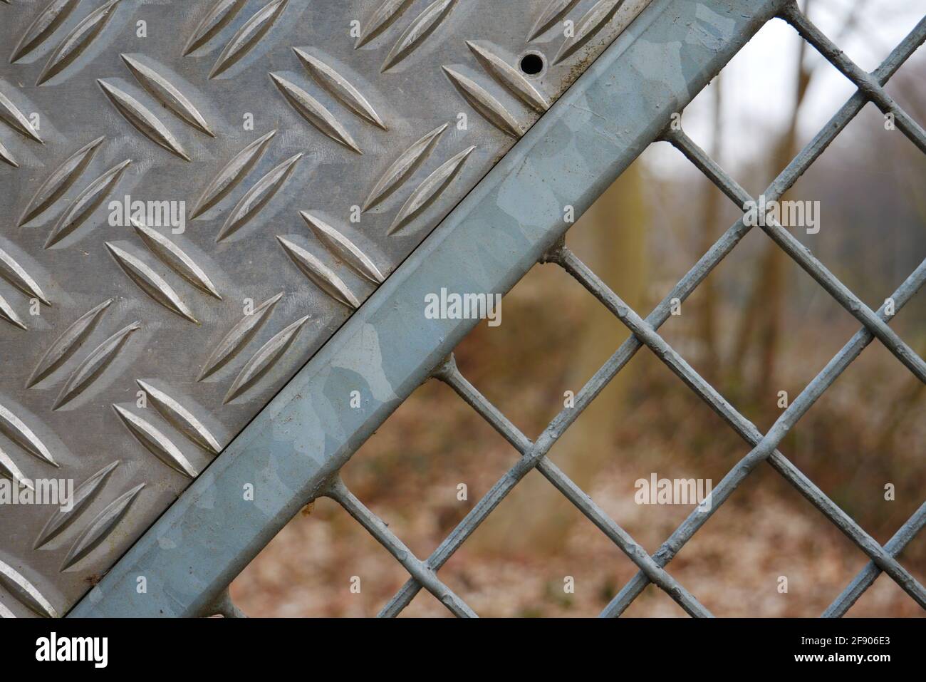 close up of metal railing with two different railings made of grid and ...