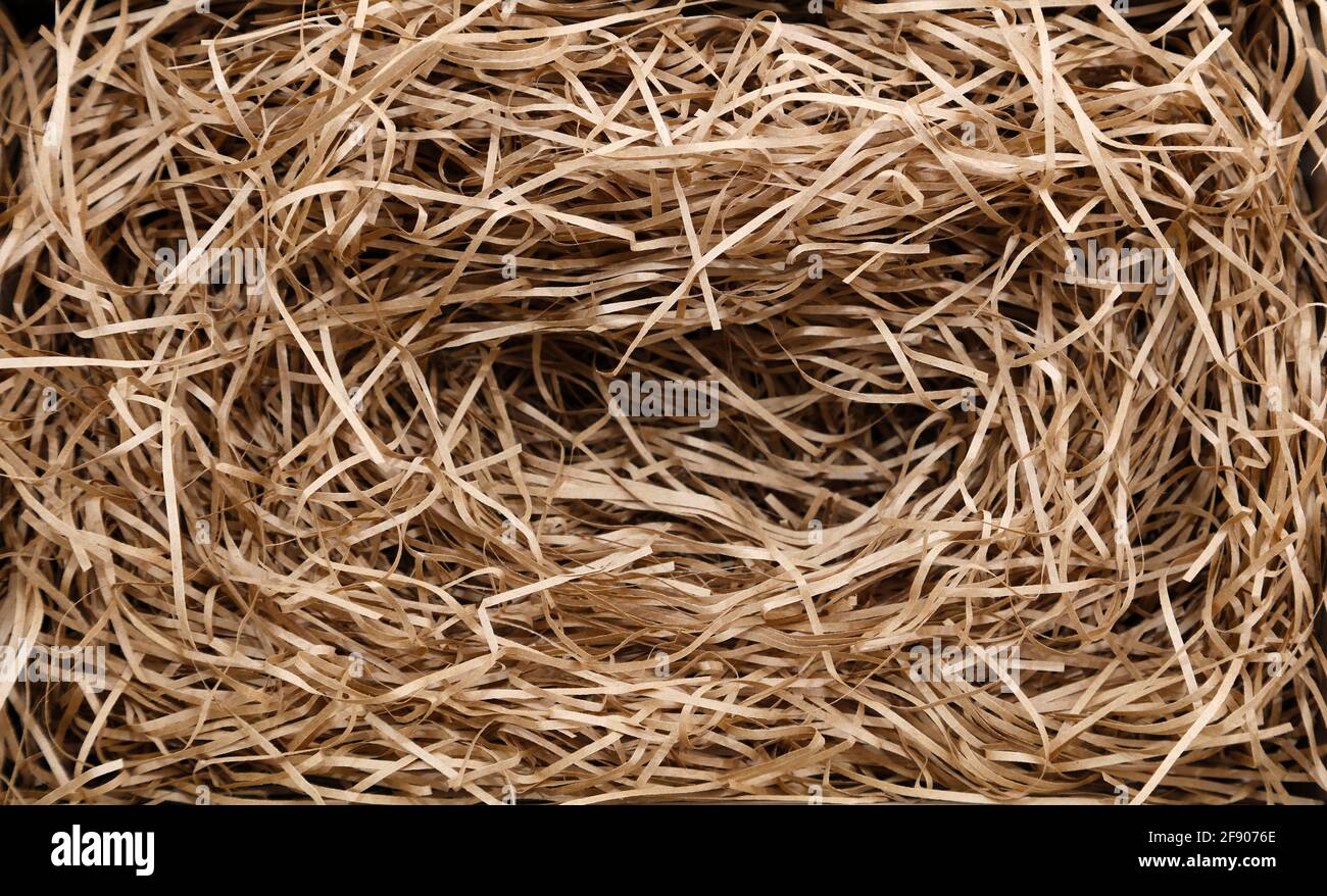 Shredded brown paper packaging close-up Stock Photo - Alamy