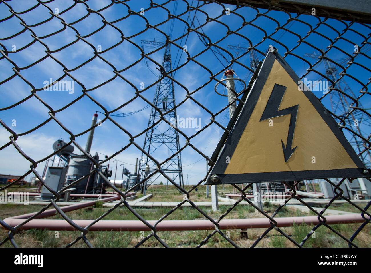Electric transformer and distribution substation. Hand-made sign of ...