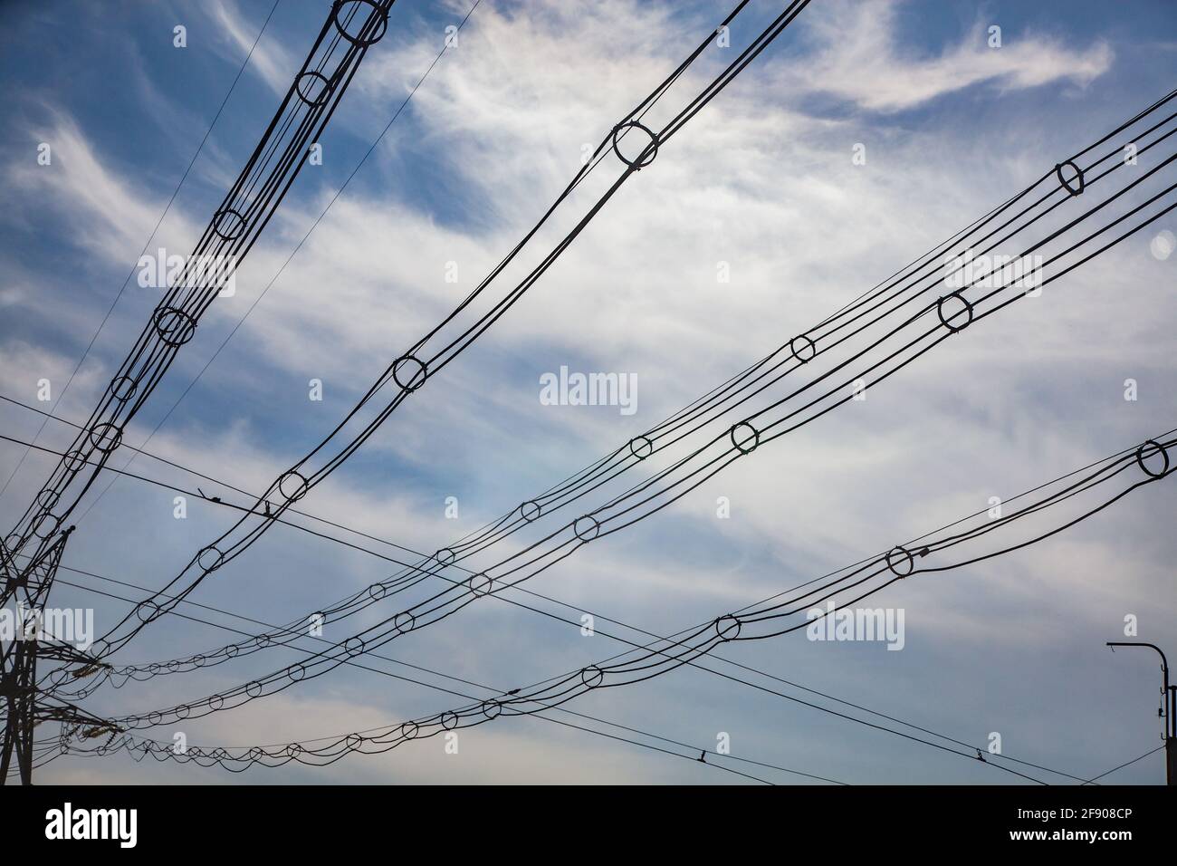High-voltage electric wires on beautiful blue sky with clouds Stock ...