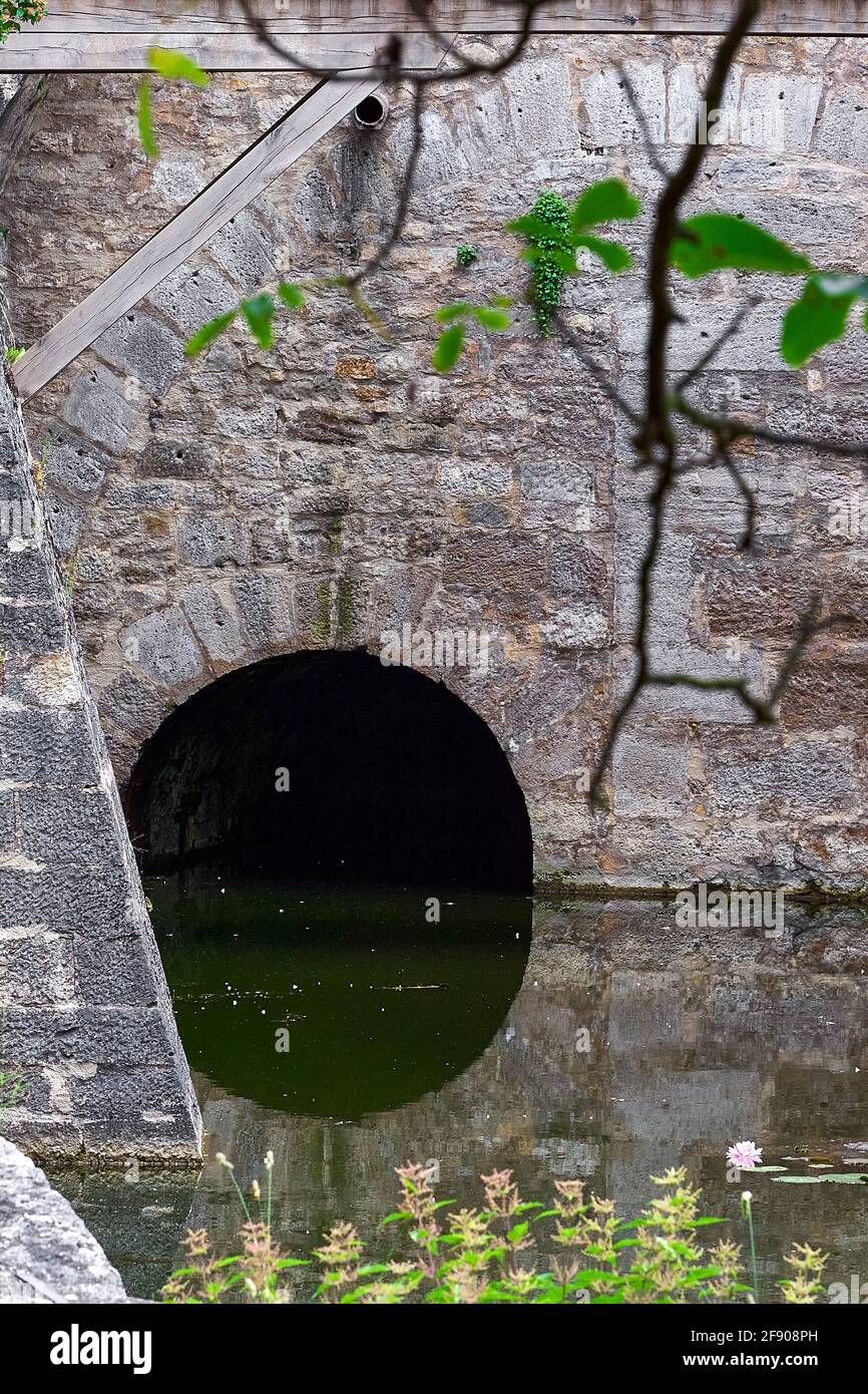 Circular stone arch and drainage opening beneath Rothenburg’s medieval ...