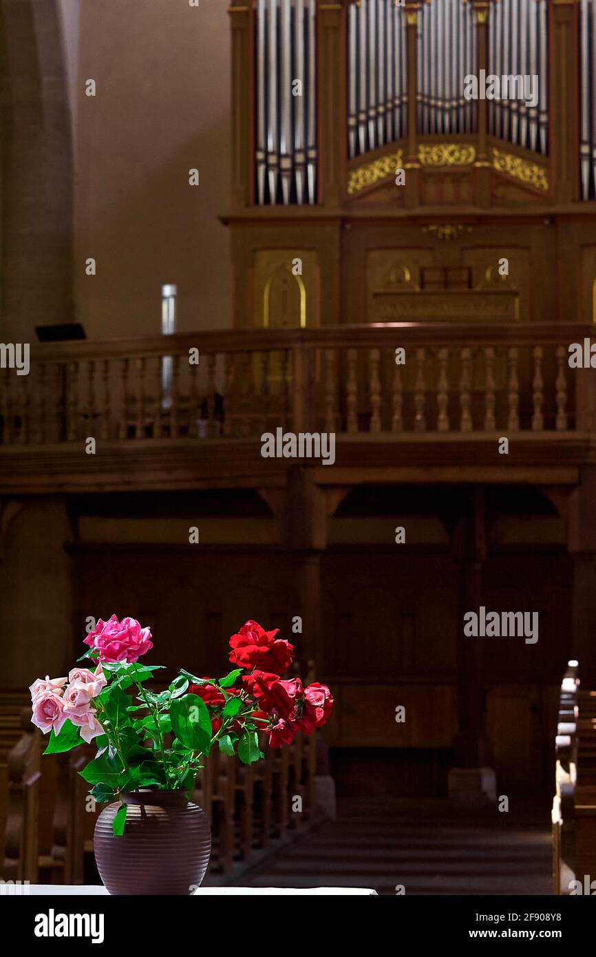 Pipe organ and floral arrangement inside historic church interior with ...