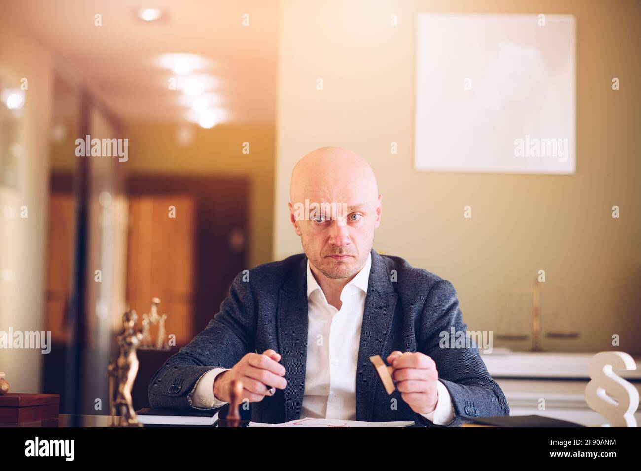 Lawyer or attorney working in the office. He prepares and signs ...