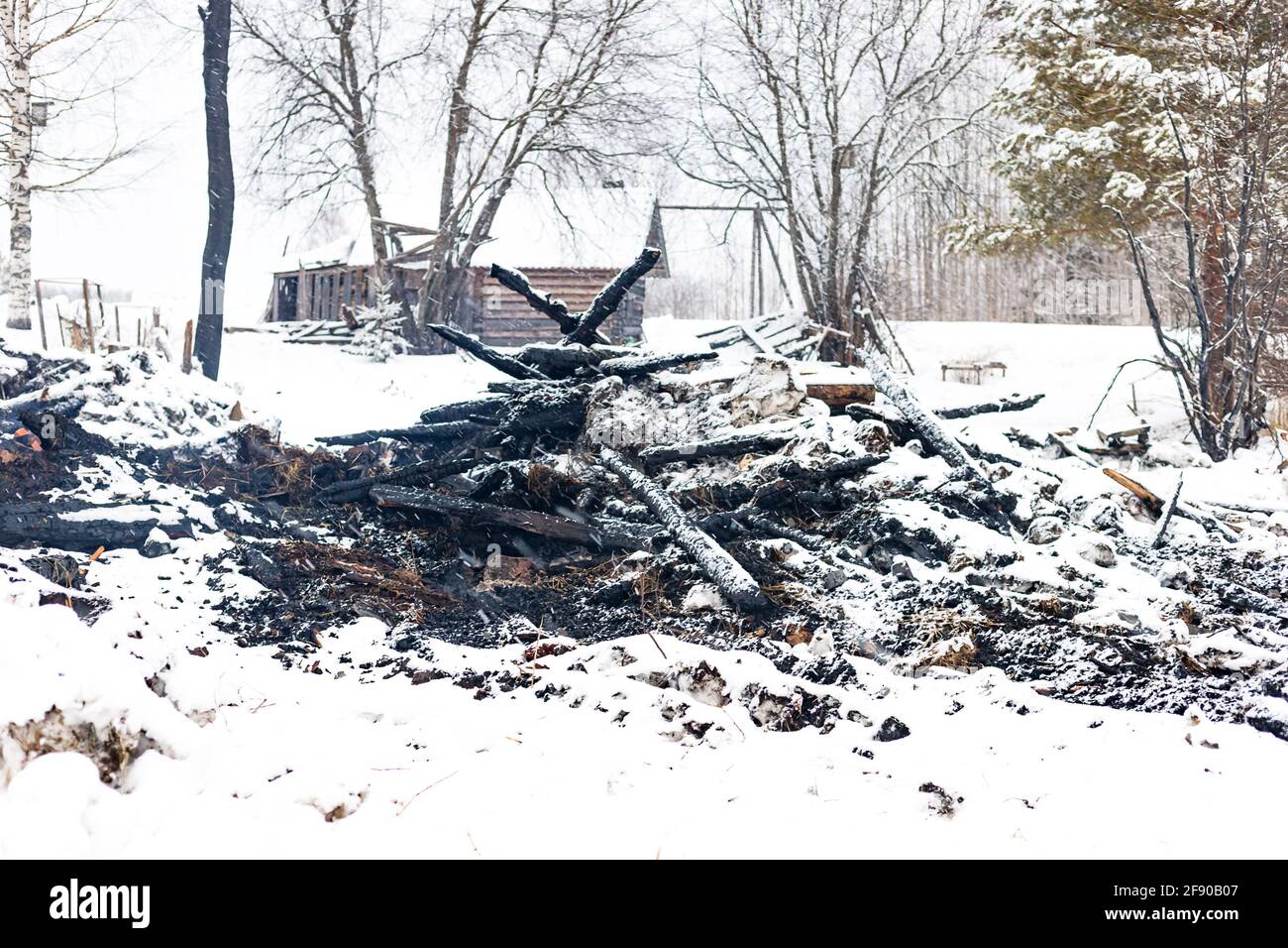 Ruins of house burned in fire conflagration on smoke snow winter ...