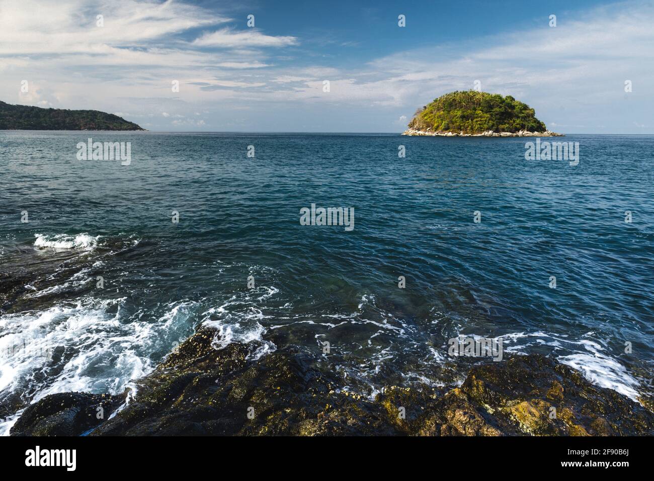 Alone little island in ocean Stock Photo - Alamy