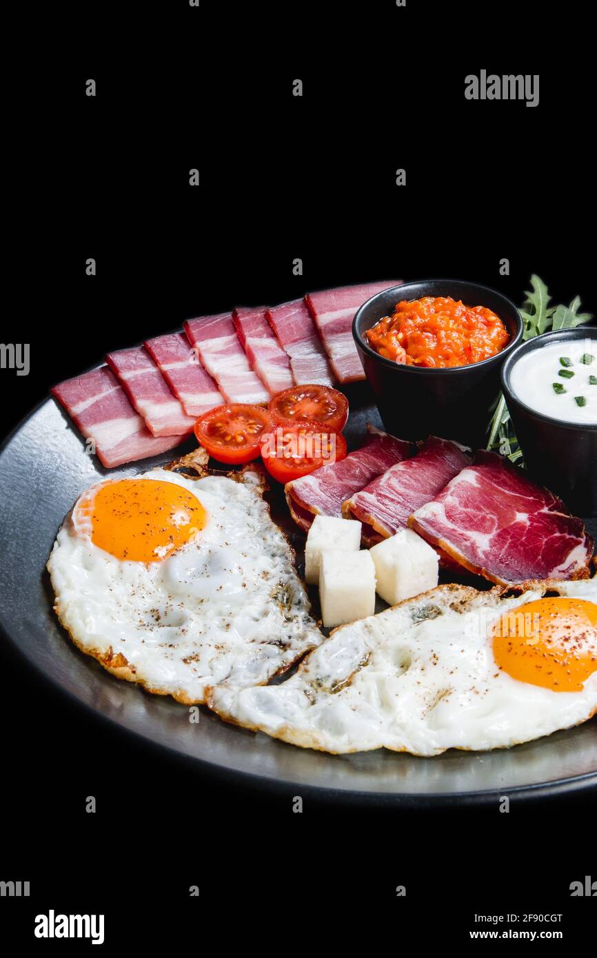 Healthy breakfast with eggs, dry meat and vegetables Stock Photo - Alamy