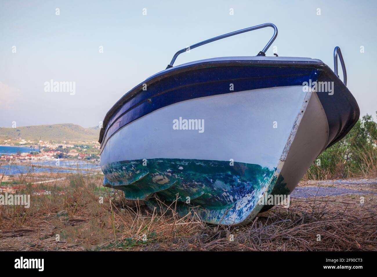Old boat standing lonely away from the sea Stock Photo - Alamy