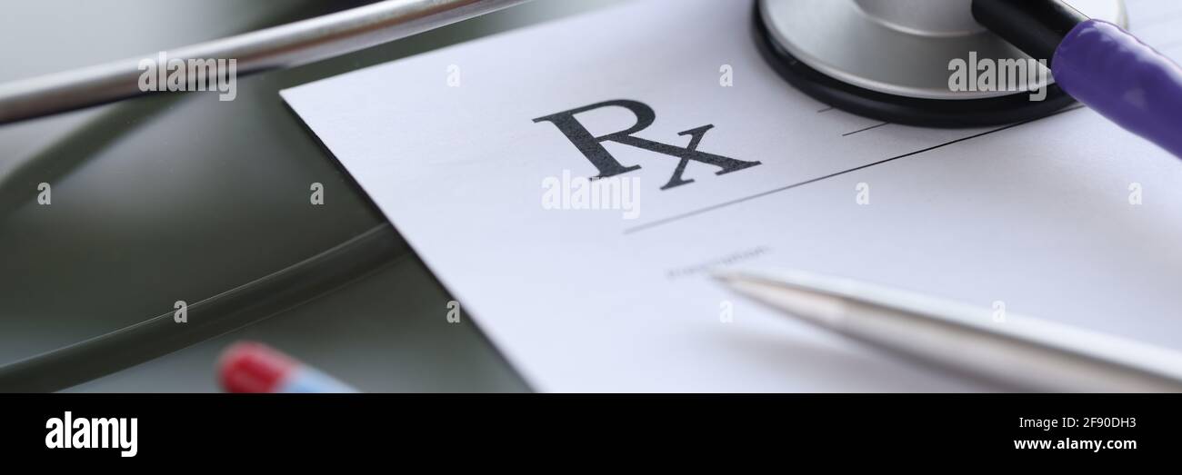 Ballpoint pen lying on medical prescription near phonendoscope in ...