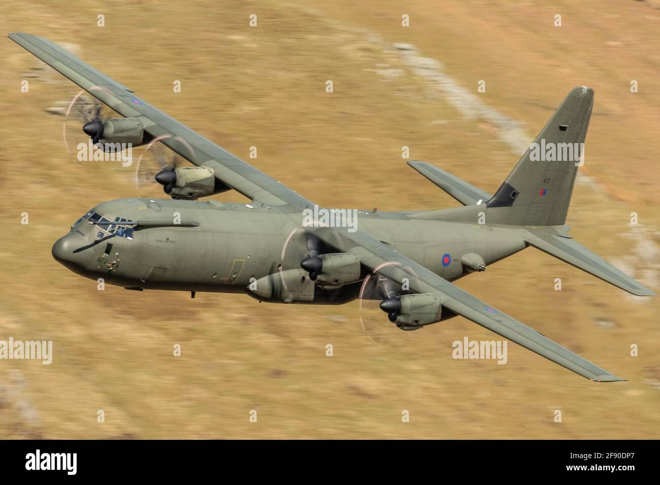 Hercules low level in the Mach Loop Stock Photo - Alamy