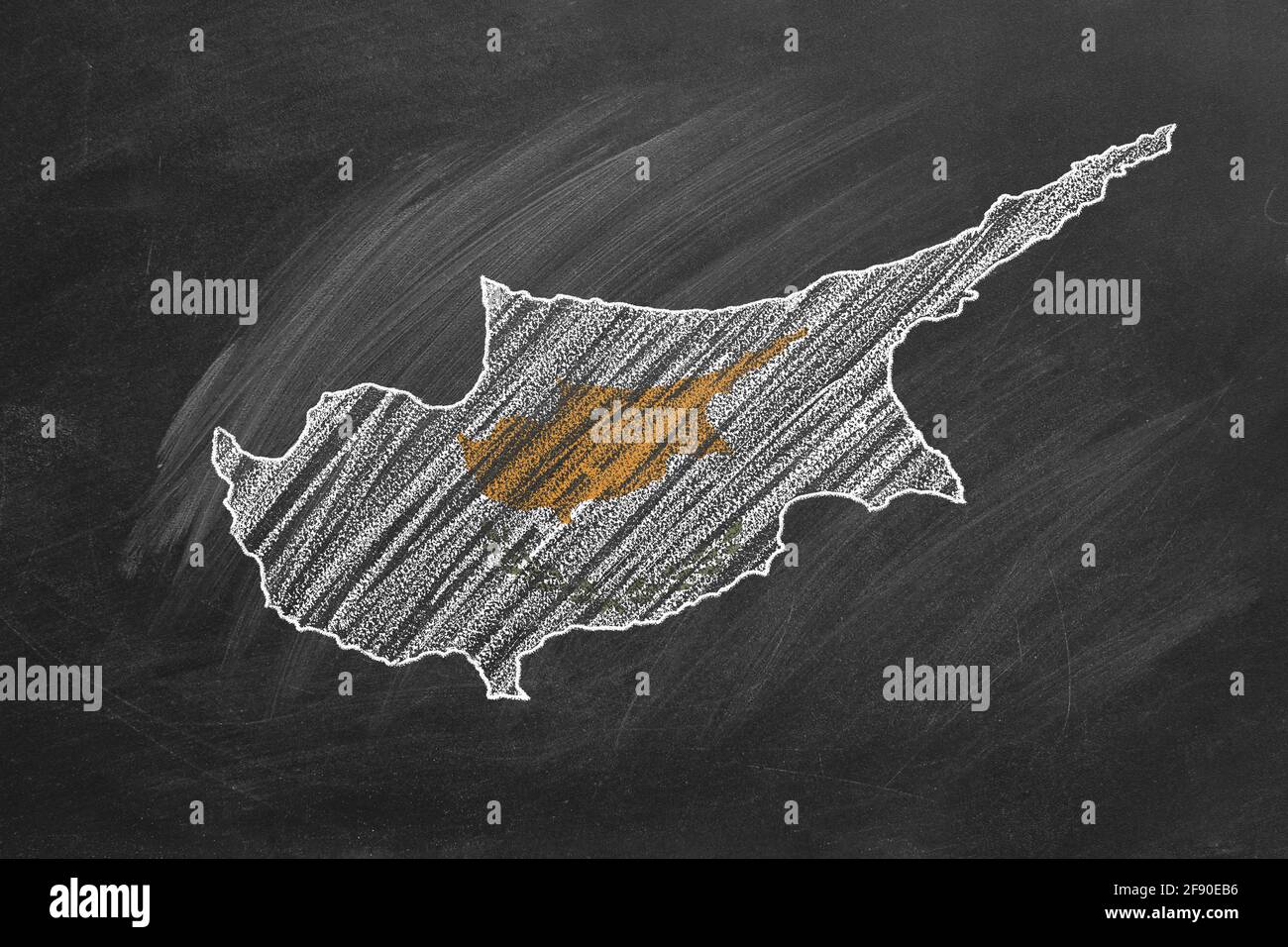 Country map and flag of Cyprus drawing with chalk on a blackboard. One ...