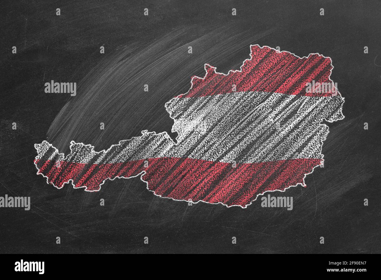 Country map and flag of Austria drawing with chalk on a blackboard. One ...
