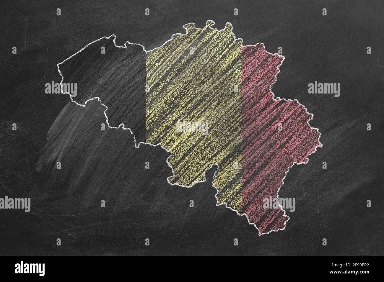 Country map and flag of Belgium drawing with chalk on a blackboard. One ...